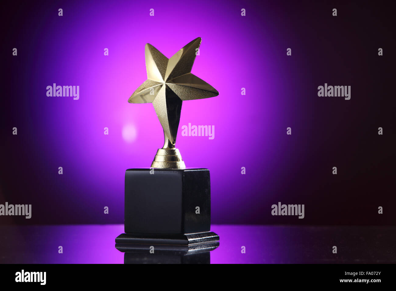 star trophy on the purple background Stock Photo - Alamy