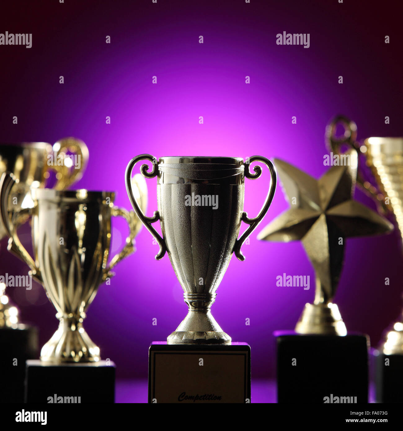 group of the trophy with purple background Stock Photo - Alamy
