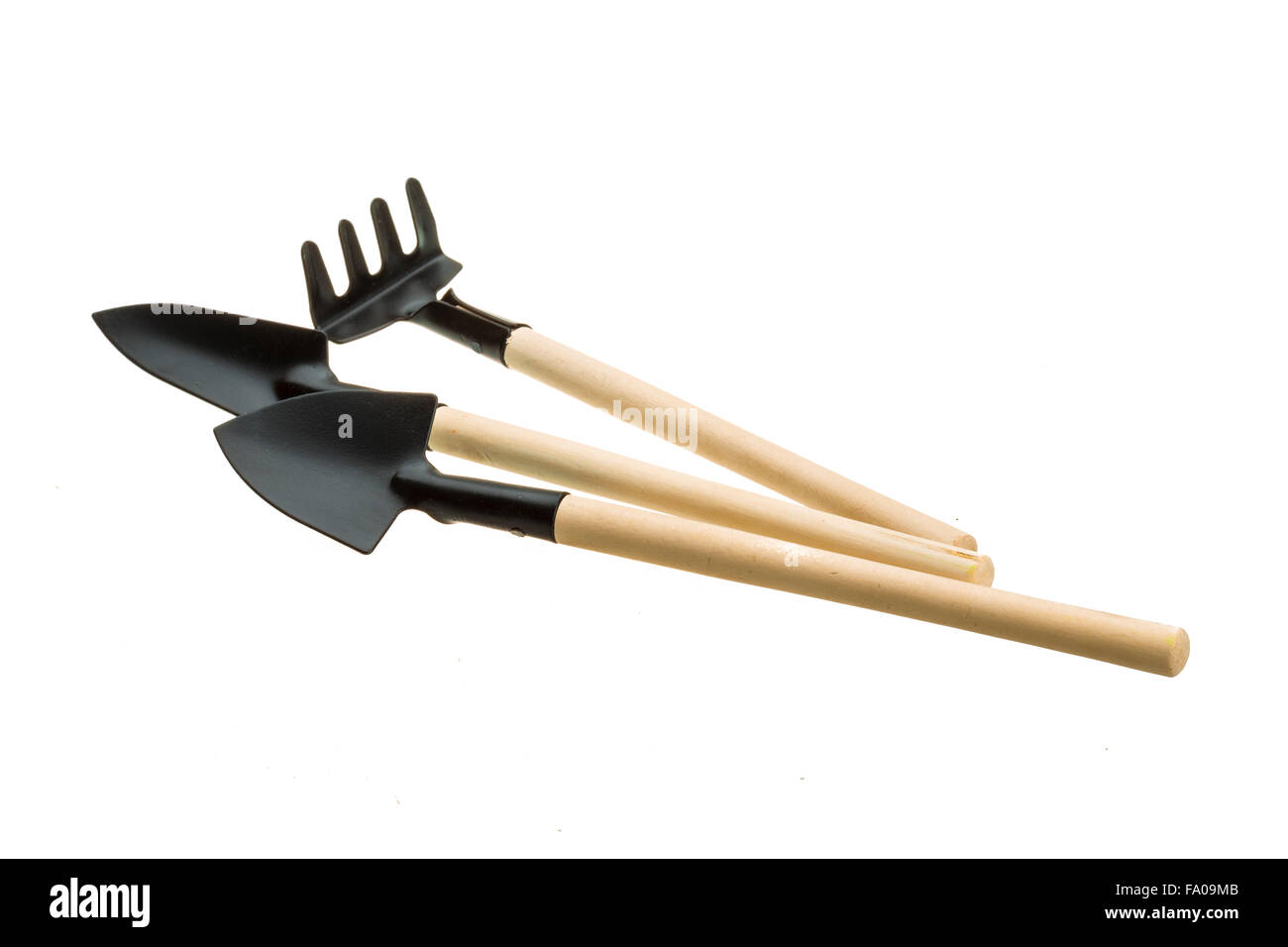 Two Shovel and Rake isolated Stock Photo - Alamy
