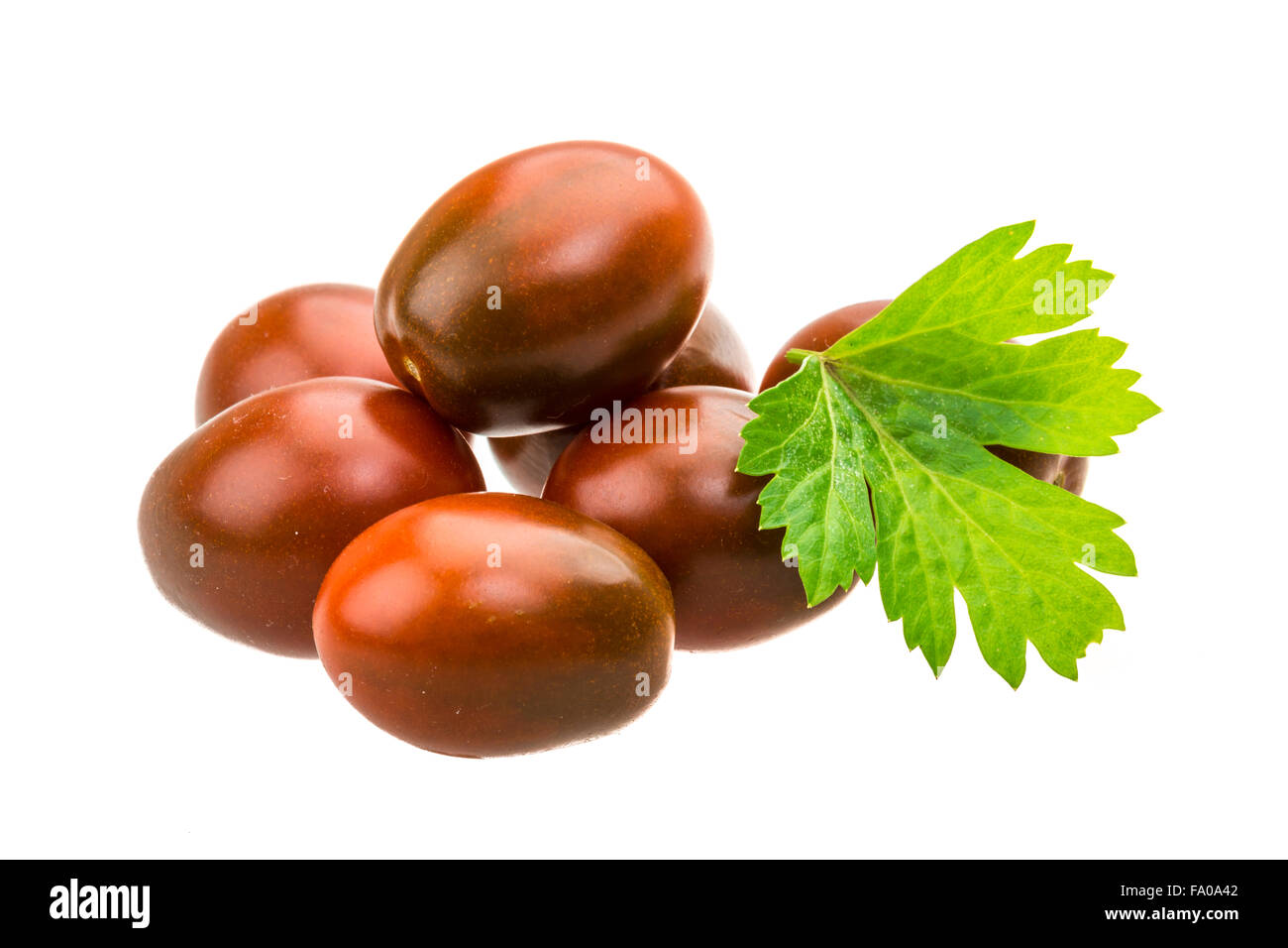 Kumato - black cherry tomato Stock Photo - Alamy