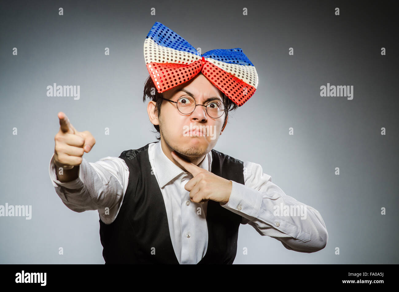 Funny man with giant bow tie Stock Photo - Alamy