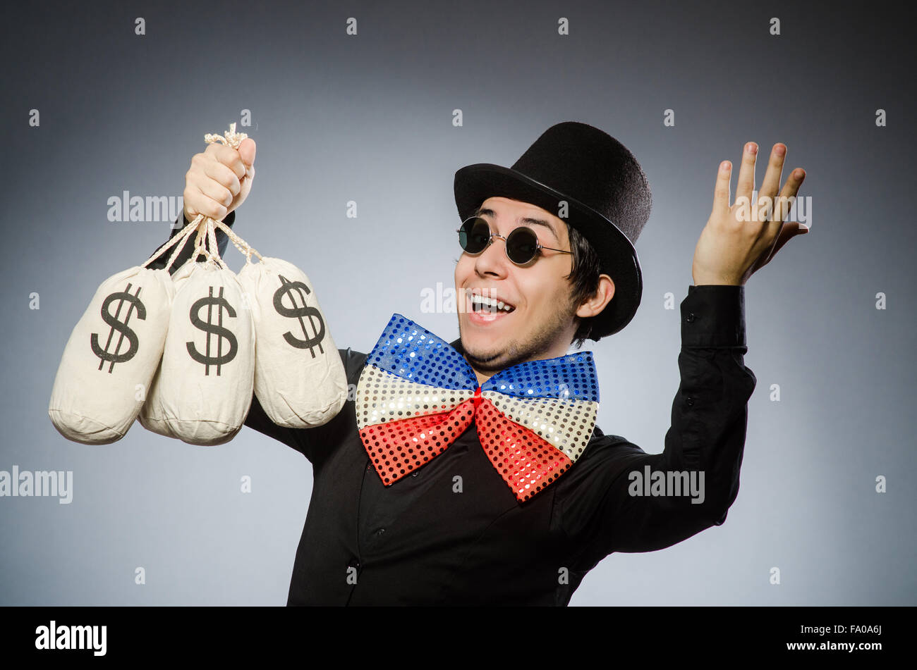 Funny man with money dollar sacks Stock Photo - Alamy