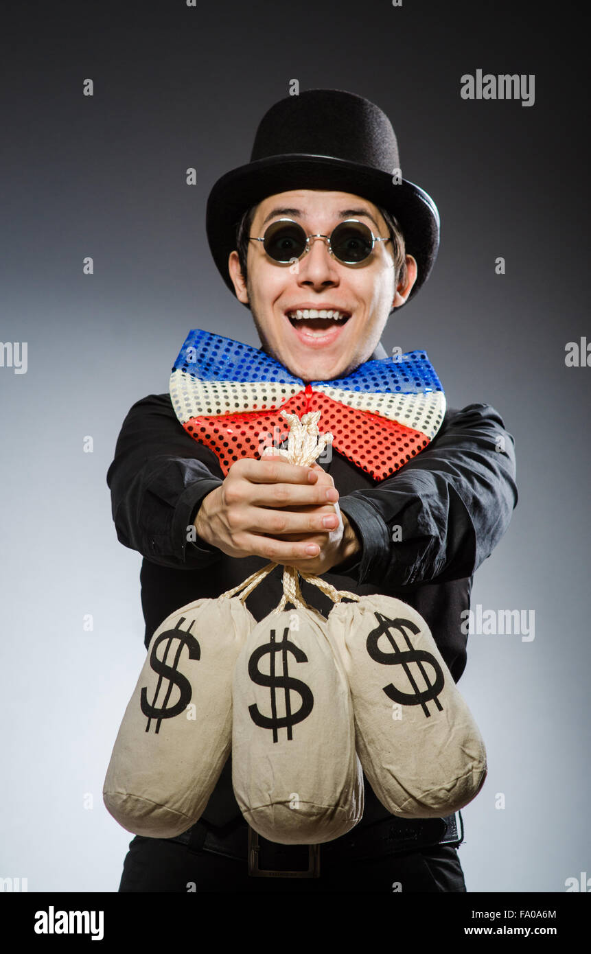 Funny man with money dollar sacks Stock Photo - Alamy