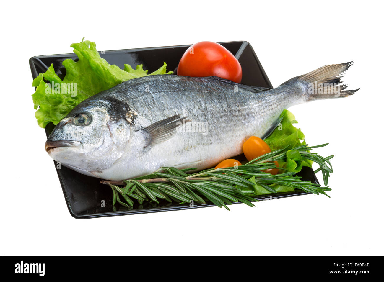 Raw dorado with herbs Stock Photo - Alamy