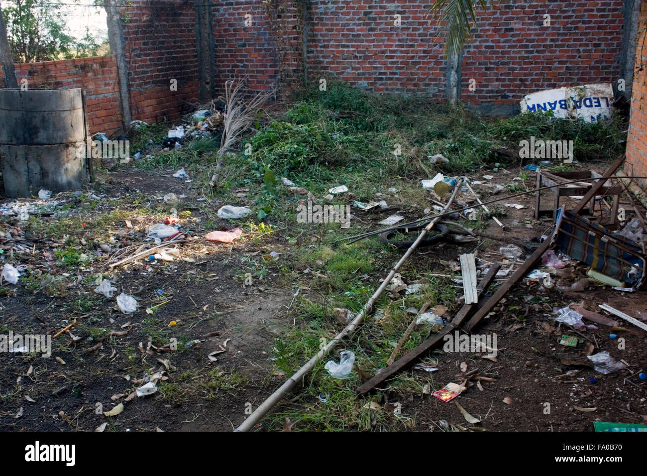 Trash is strewn in the yard of an English school in Ou Reang Ov ...