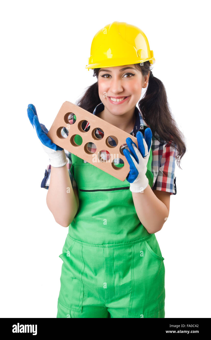 Female workman in green overalls holding brick isolated on white Stock ...