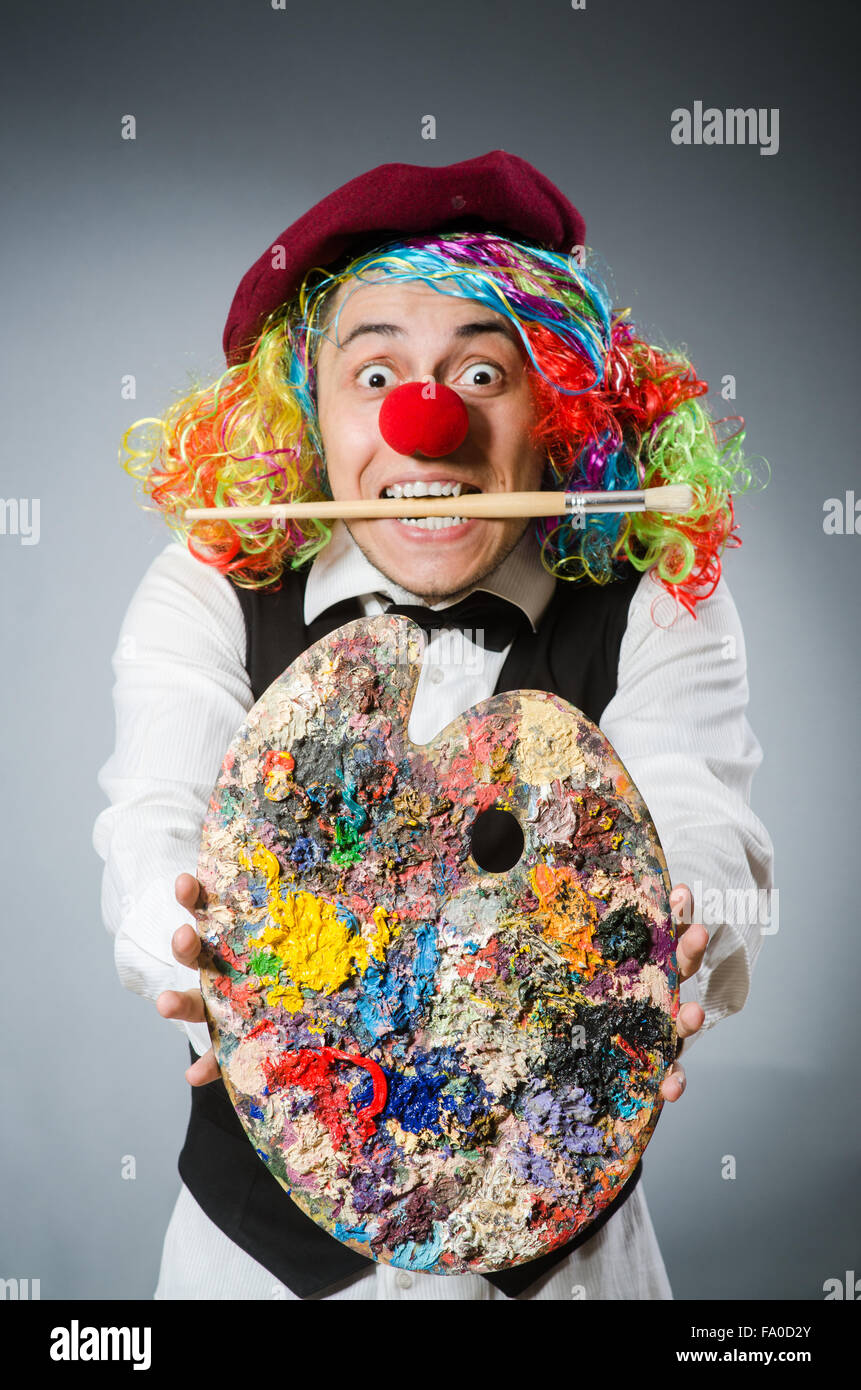 Funny artist in dark studio Stock Photo - Alamy