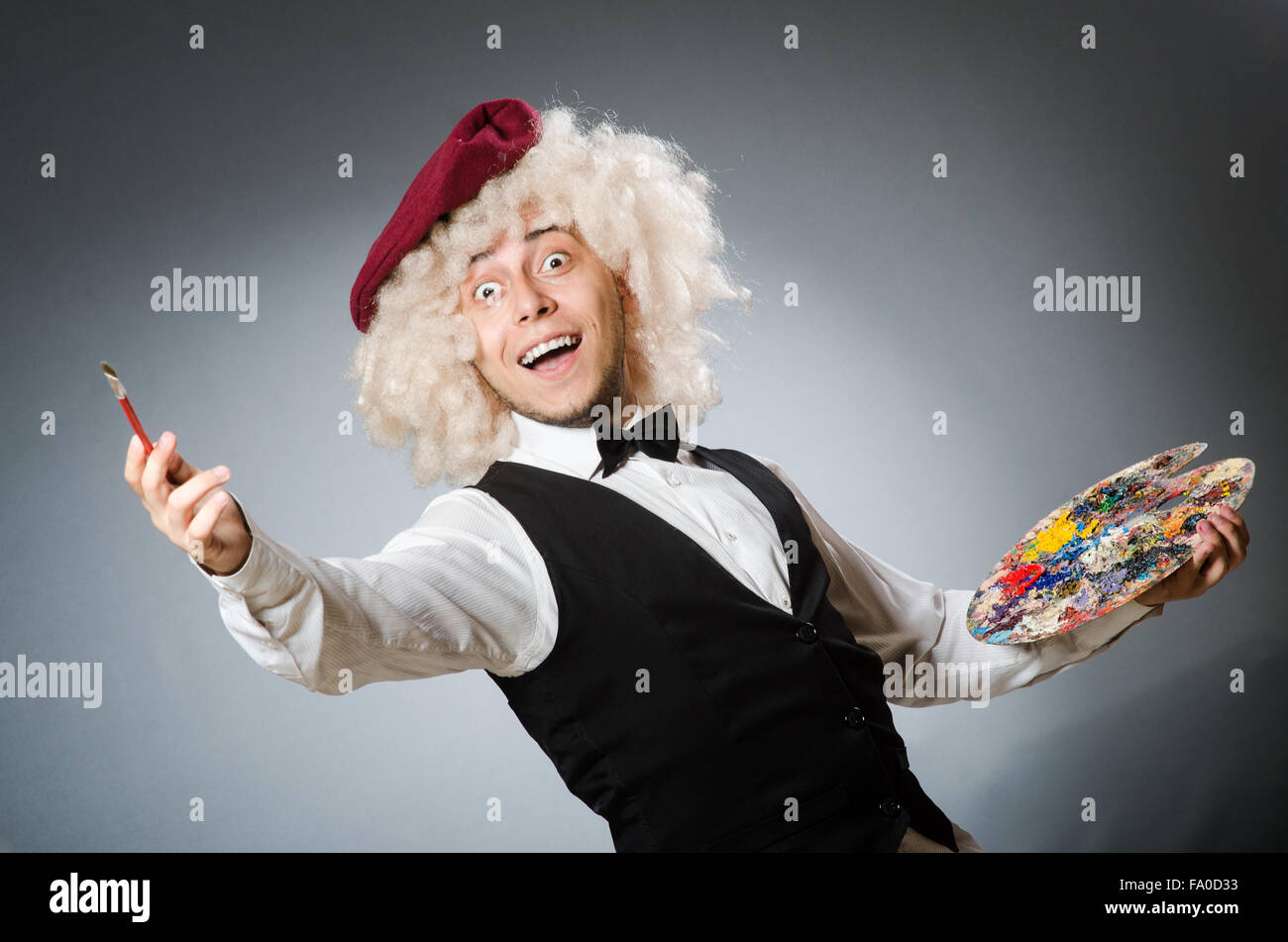 Funny artist in dark studio Stock Photo - Alamy