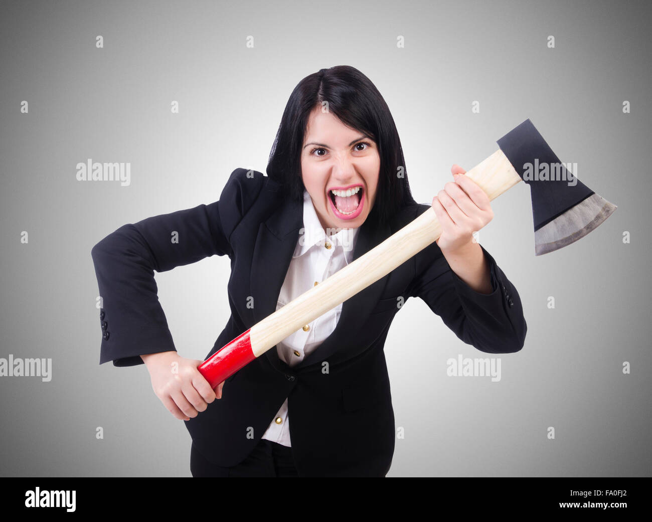 Angry businesswoman with axe on white Stock Photo - Alamy