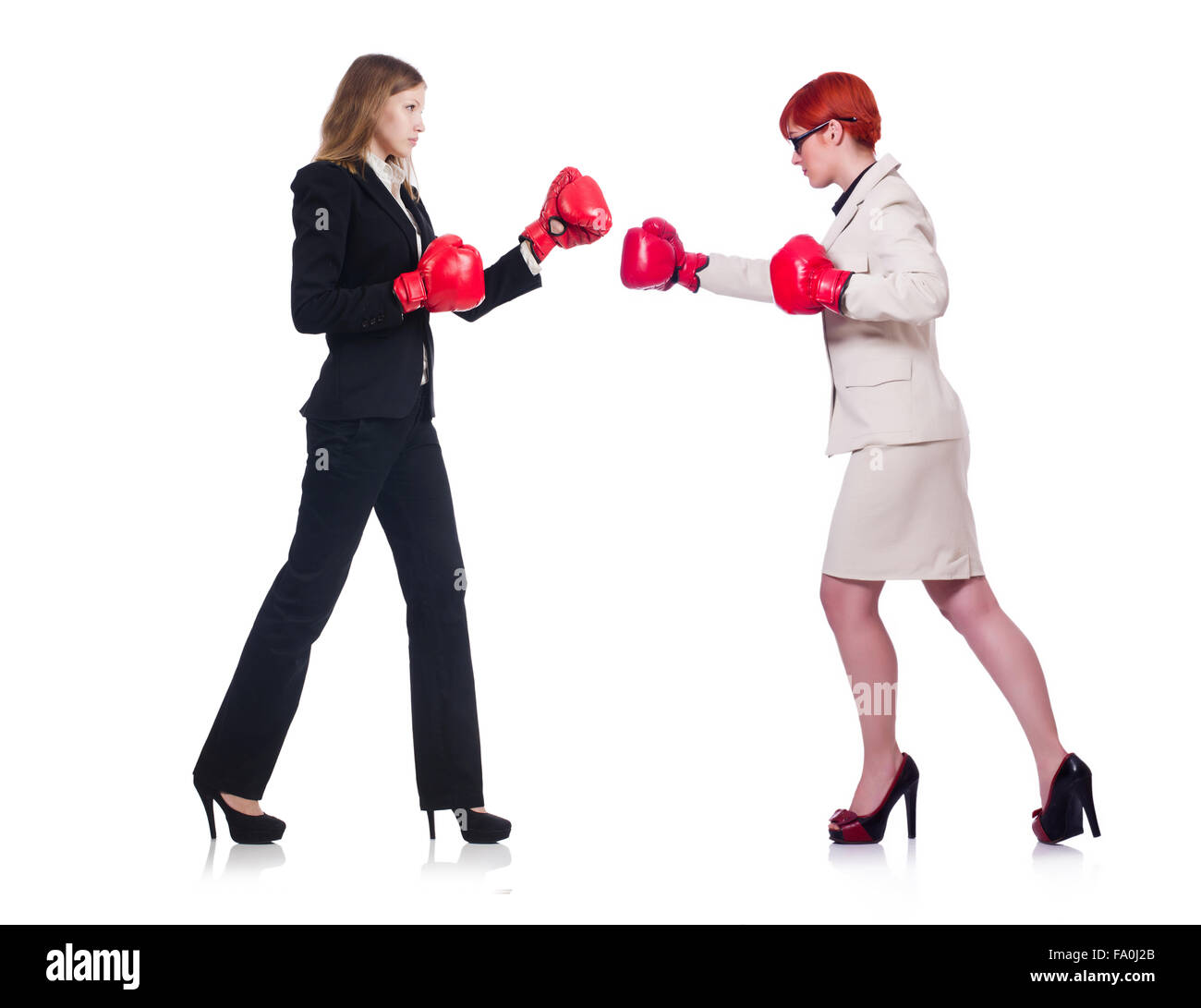 Two businesswomen boxing isolated on white Stock Photo - Alamy
