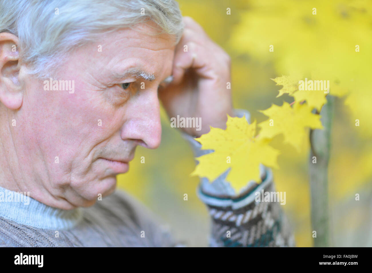 Senior man thinking Stock Photo - Alamy