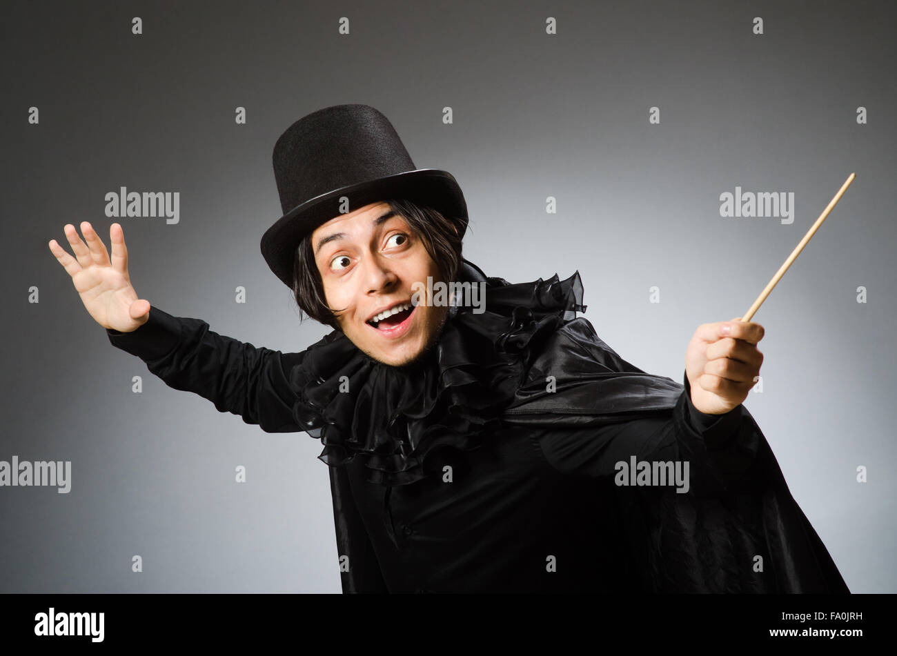 Funny magician wearing cylinder hat Stock Photo - Alamy