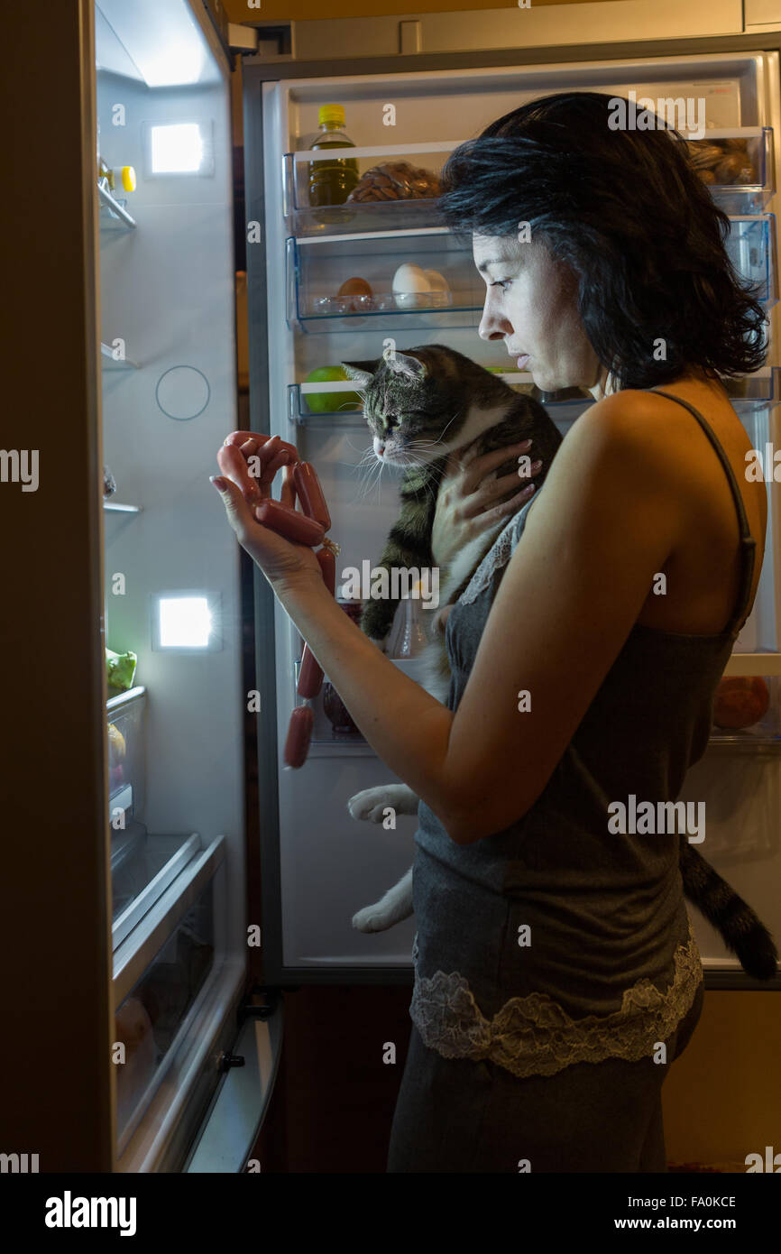 Looking cat fridge hi-res stock photography and images - Alamy