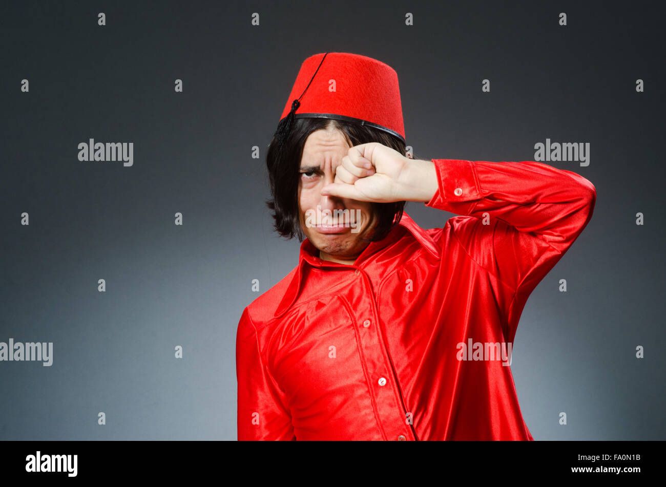Man wearing red fez hat Stock Photo - Alamy