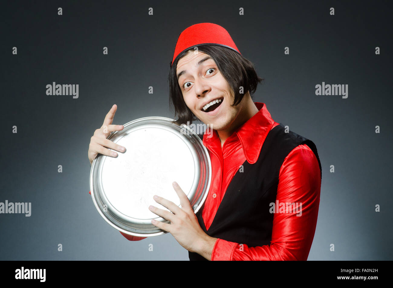 Man wearing red fez hat Stock Photo - Alamy