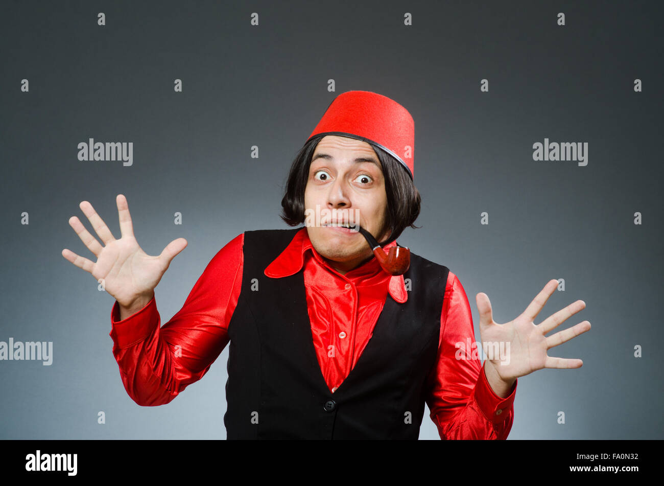 Man wearing fez hat smoking hi-res stock photography and images - Alamy