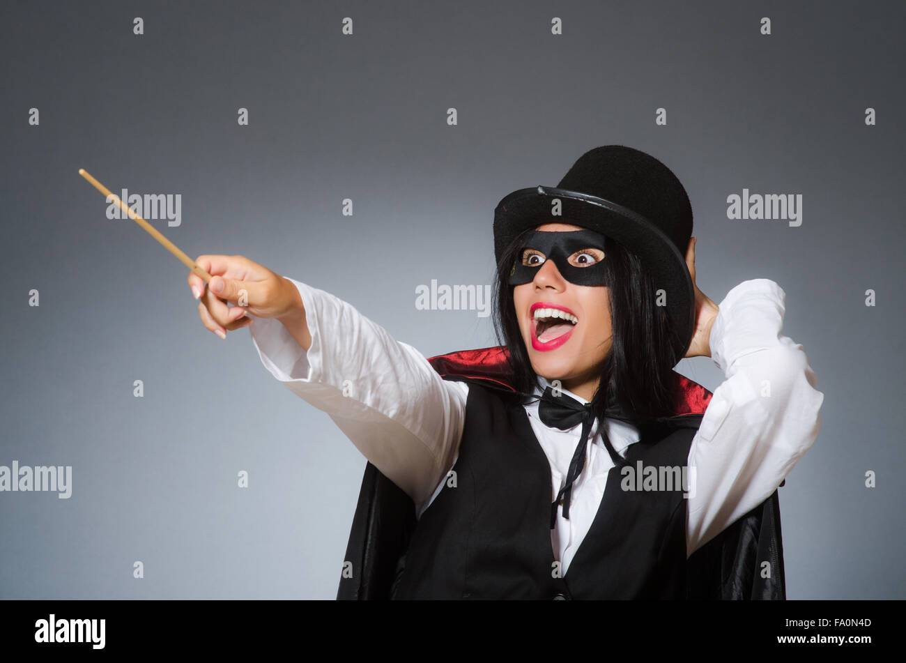 Woman magician in funny concept Stock Photo - Alamy