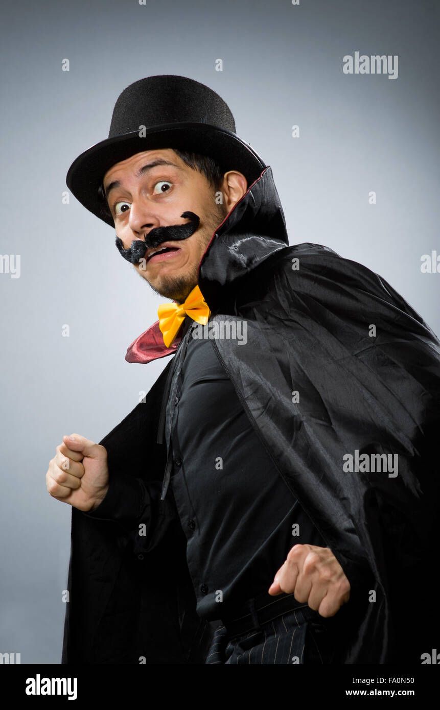 Funny magician man wearing tophat Stock Photo - Alamy