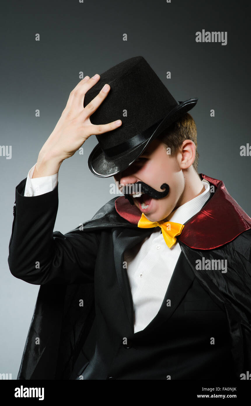 Funny magician man wearing tophat Stock Photo - Alamy