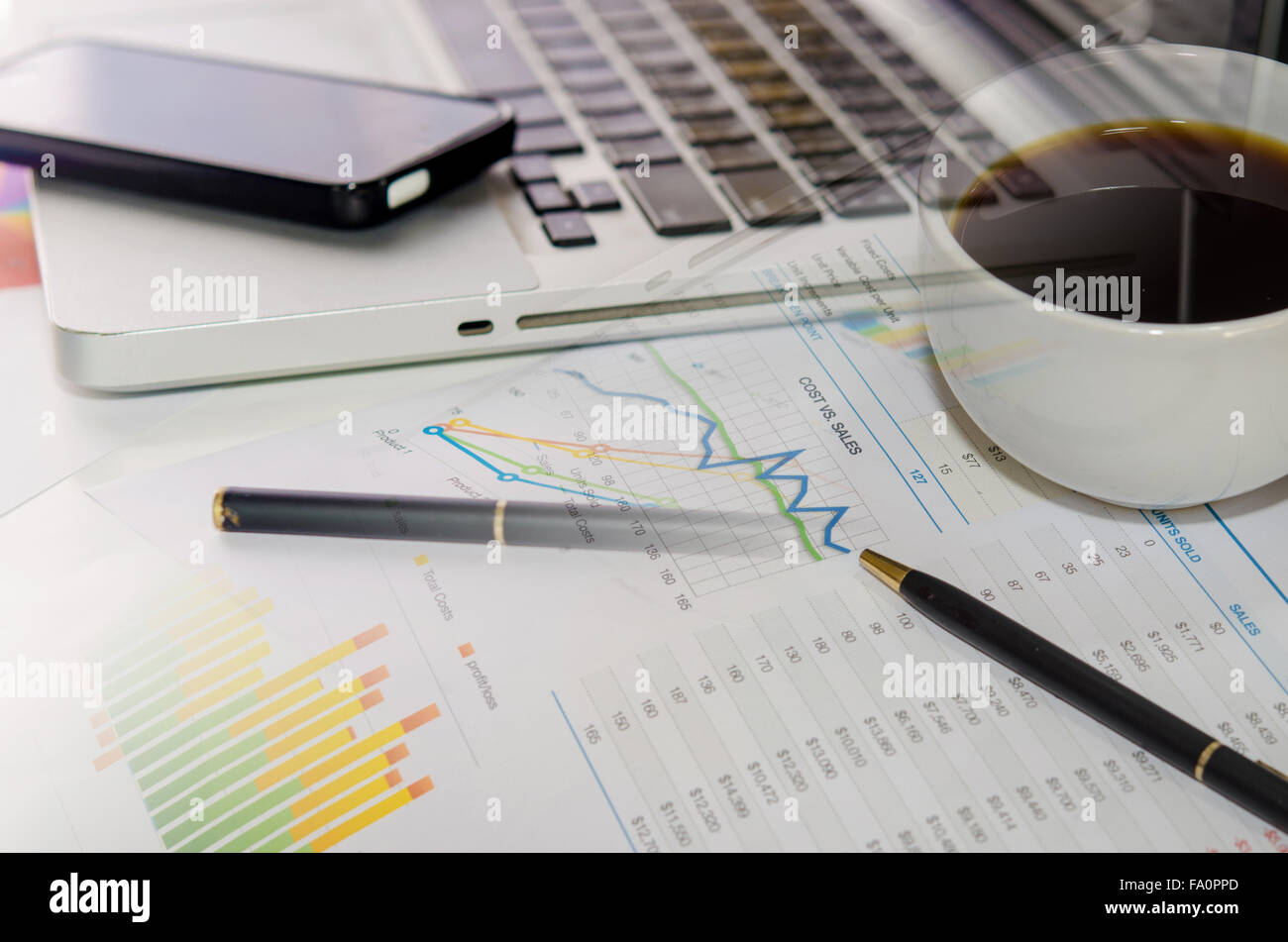 Business of financial analytics desktop with accounting charts and ...