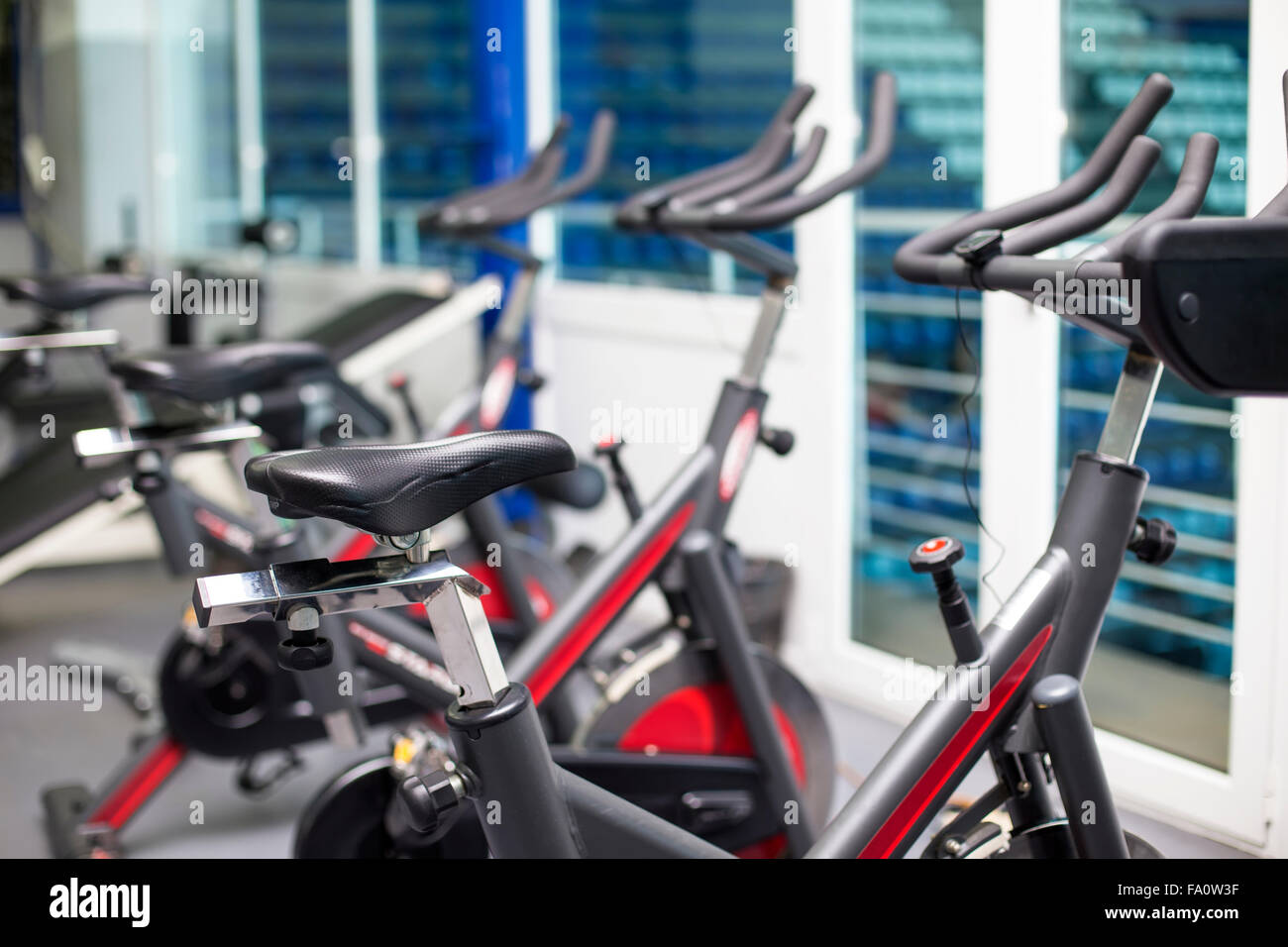 Bikes in the gym Stock Photo - Alamy
