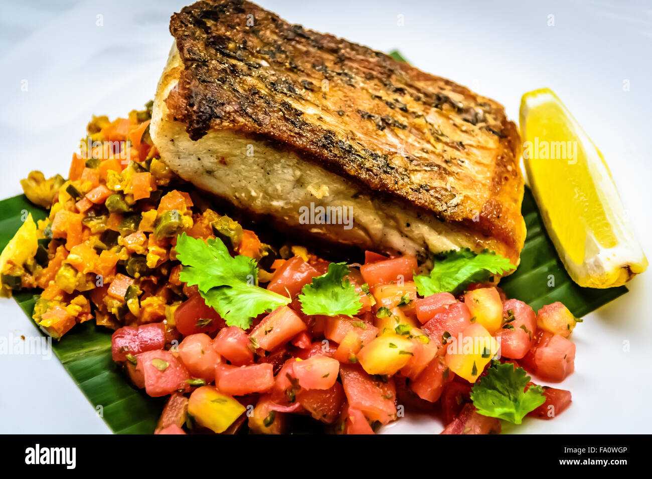 Pan fried white snapper Stock Photo - Alamy