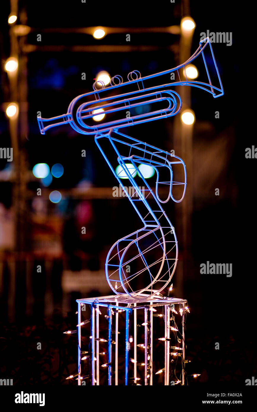 Street display feature of a neon lit key note and trumpet heralding a ...