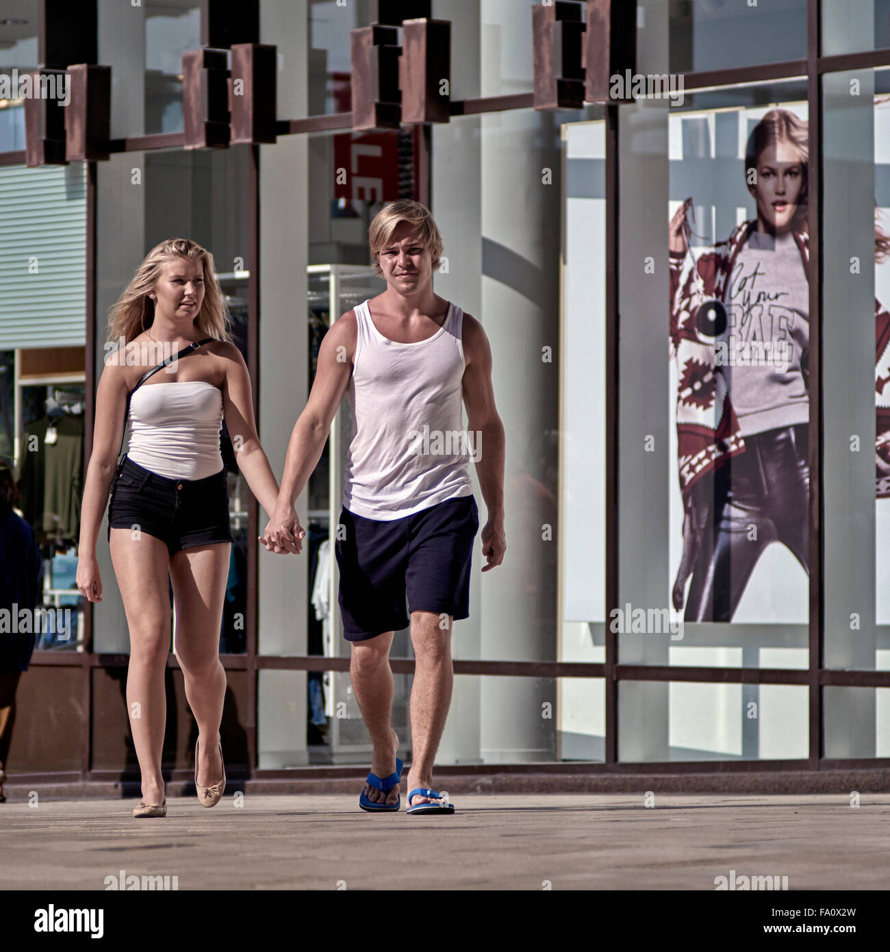 Young couple walk holding hands hi-res stock photography and images - Alamy