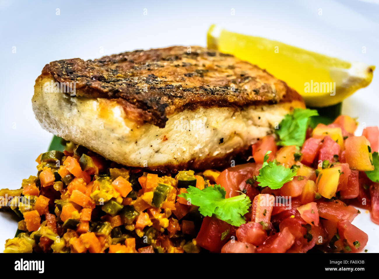 Pan fried white snapper Stock Photo - Alamy