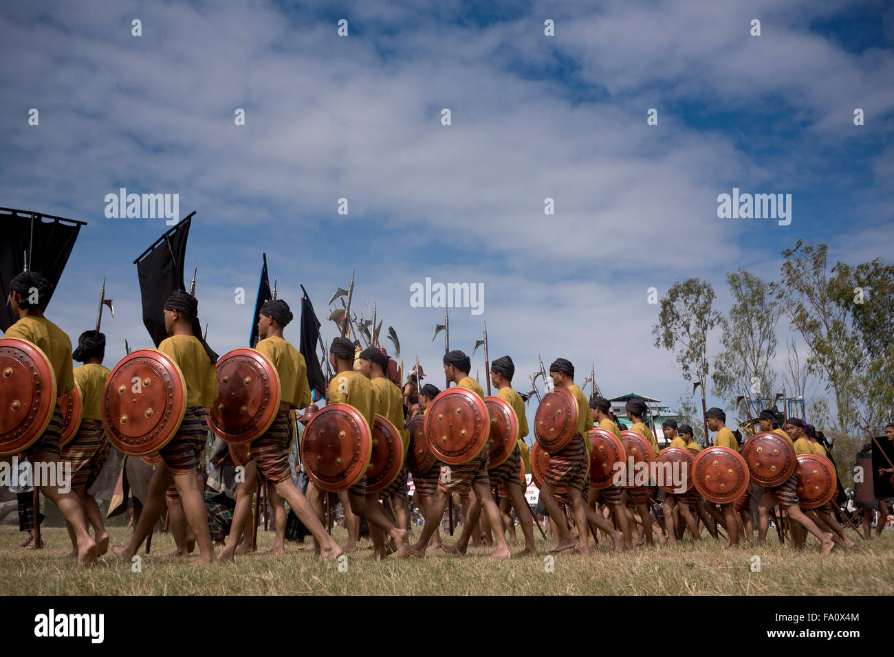 Battle reenactment. Line of marching soldiers at an ancient battle ...