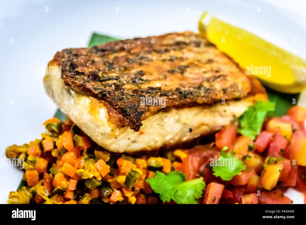 Pan fried white snapper Stock Photo - Alamy