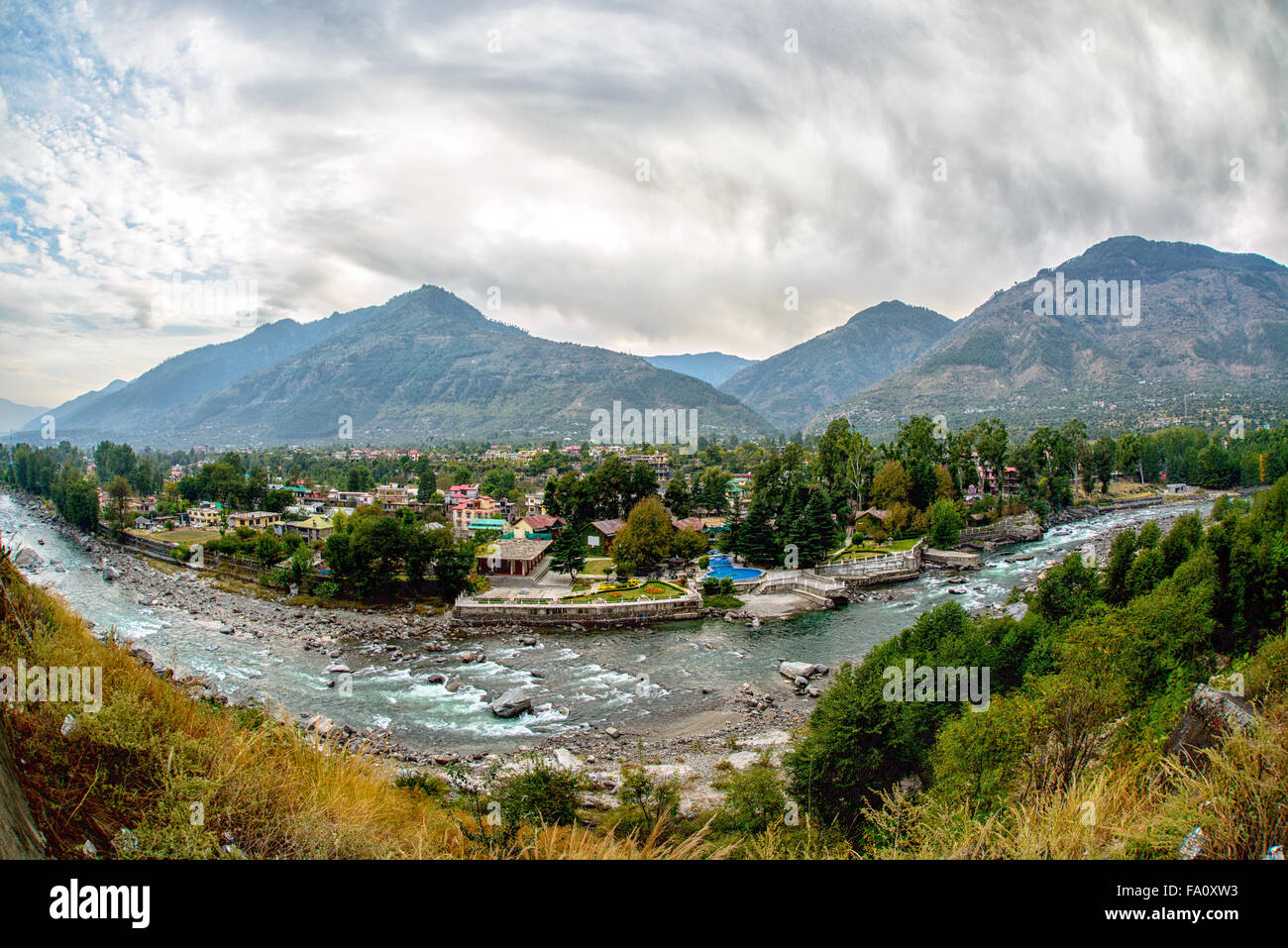 Village in Kullu Valley, Beas river foreground Stock Photo - Alamy