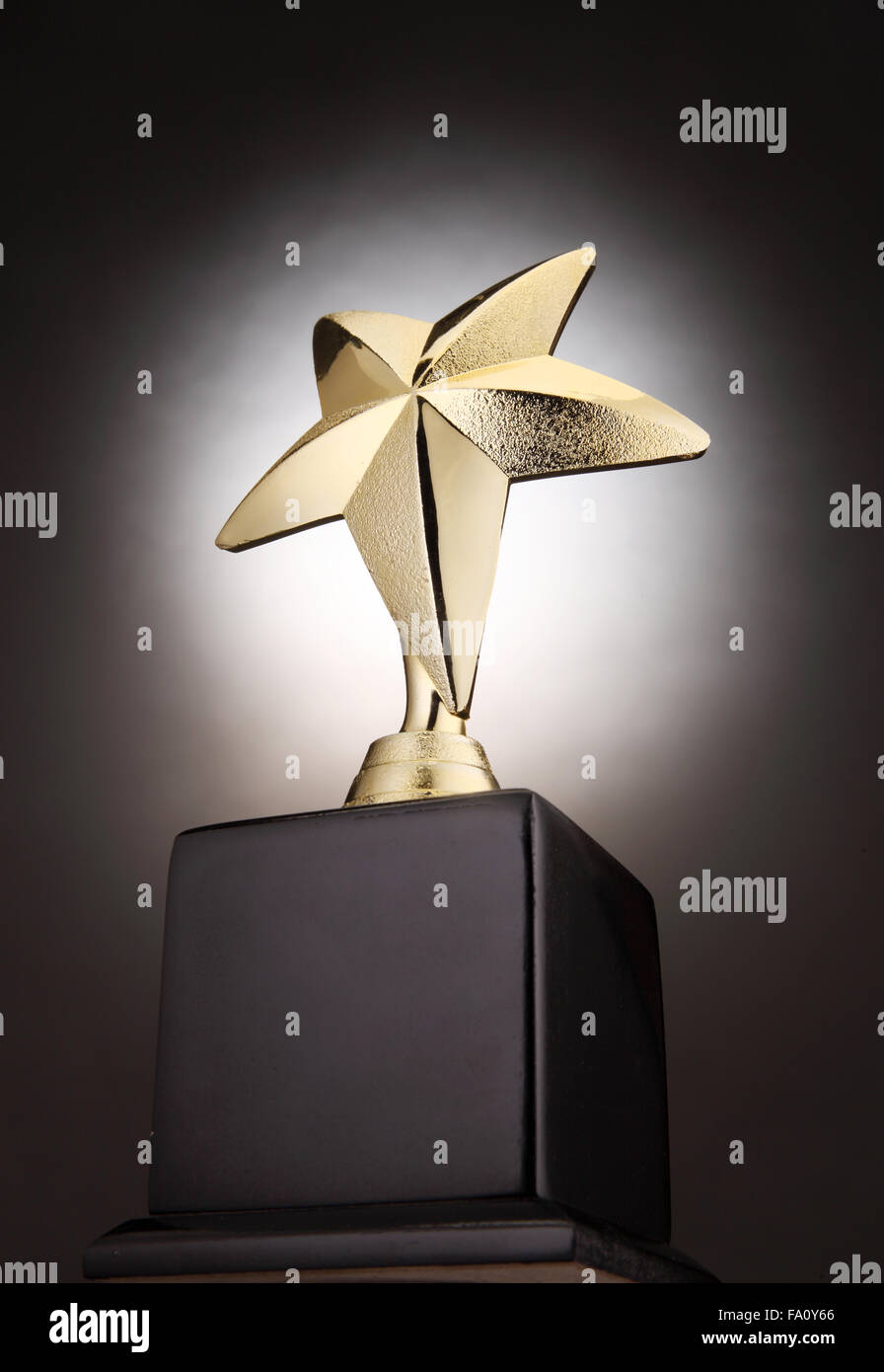 star shape trophy with a light glow Stock Photo - Alamy