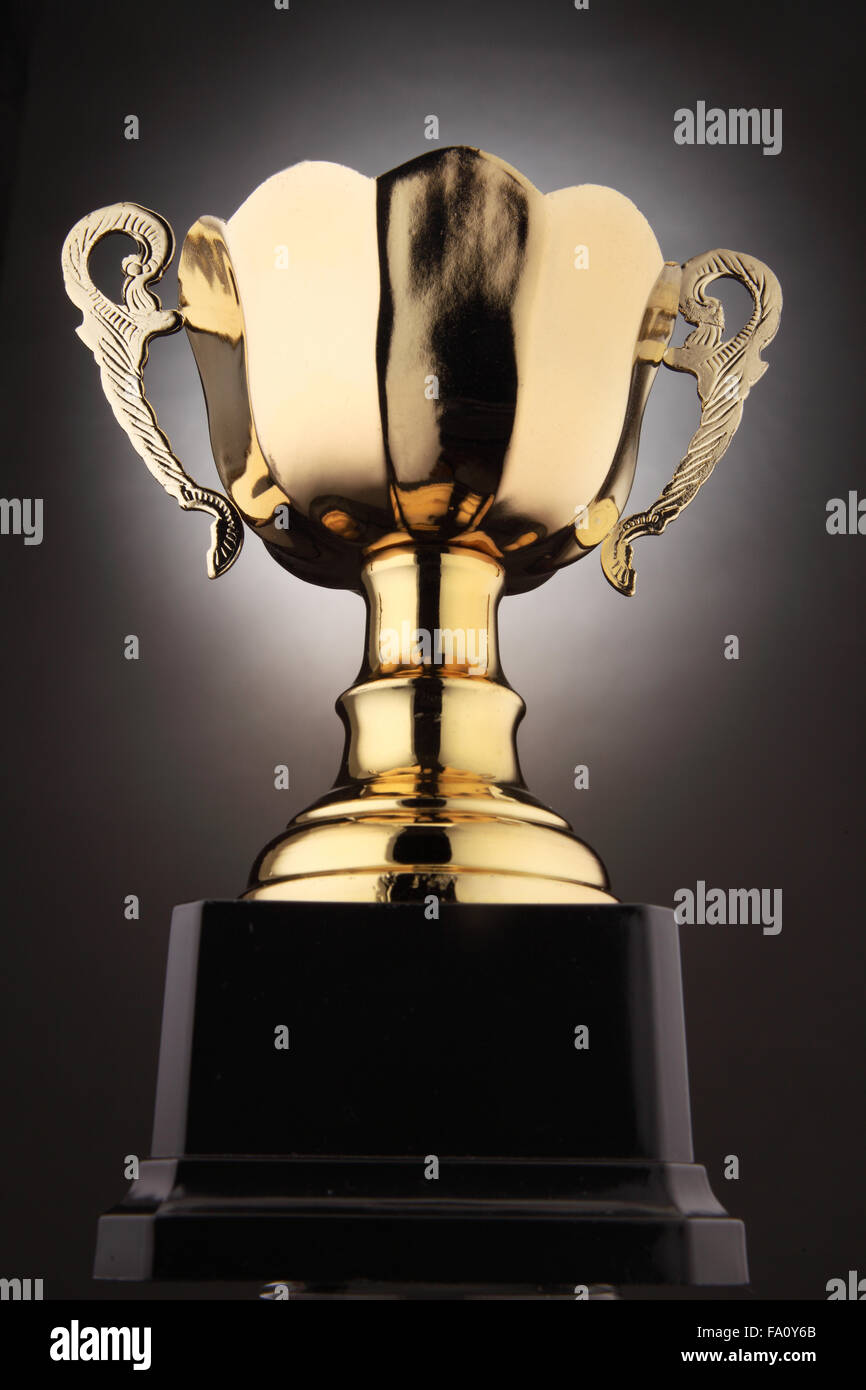 low angle of trophy with glow at the background Stock Photo - Alamy