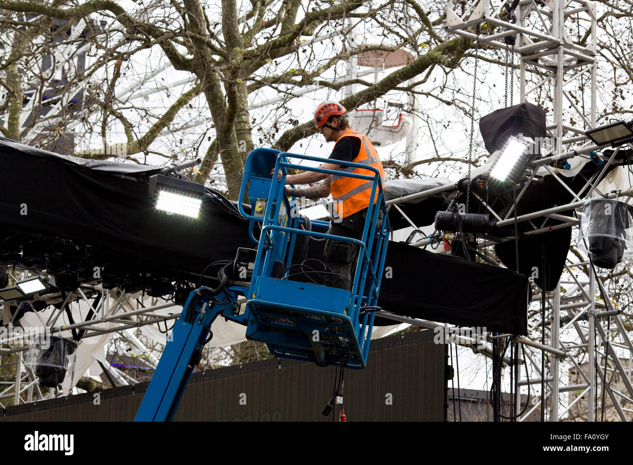 workman installing the lighting for the premier of the New Star wars ...