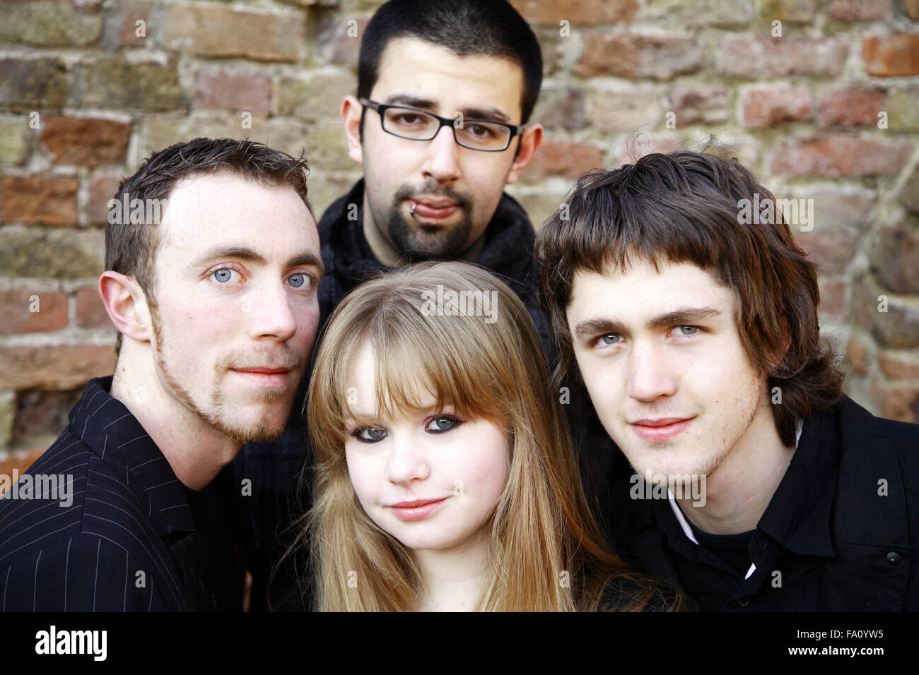 Four young friends who were in a rock metal band together Stock Photo ...