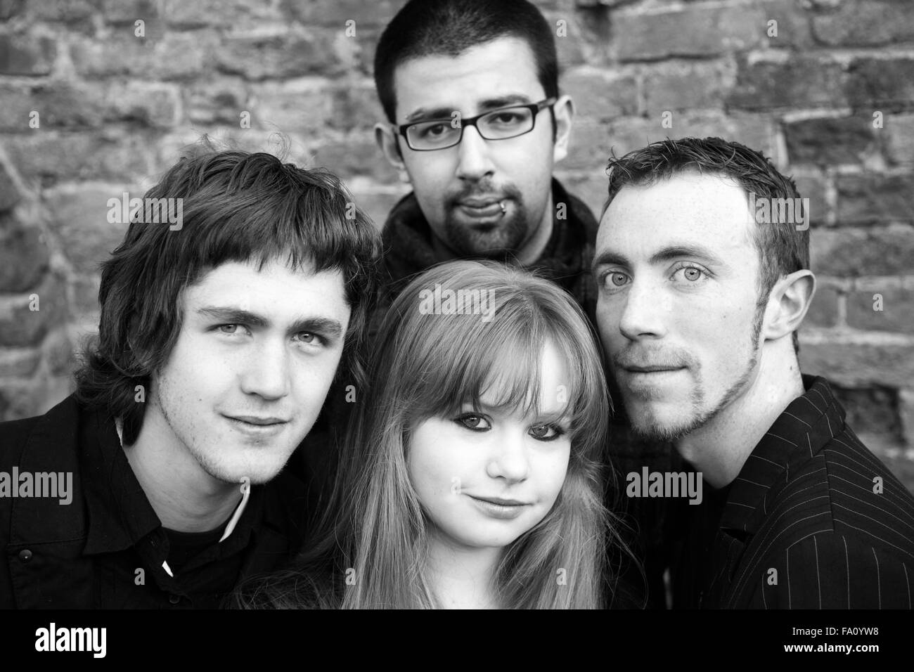 Four young friends who were in a rock metal band together Stock Photo ...