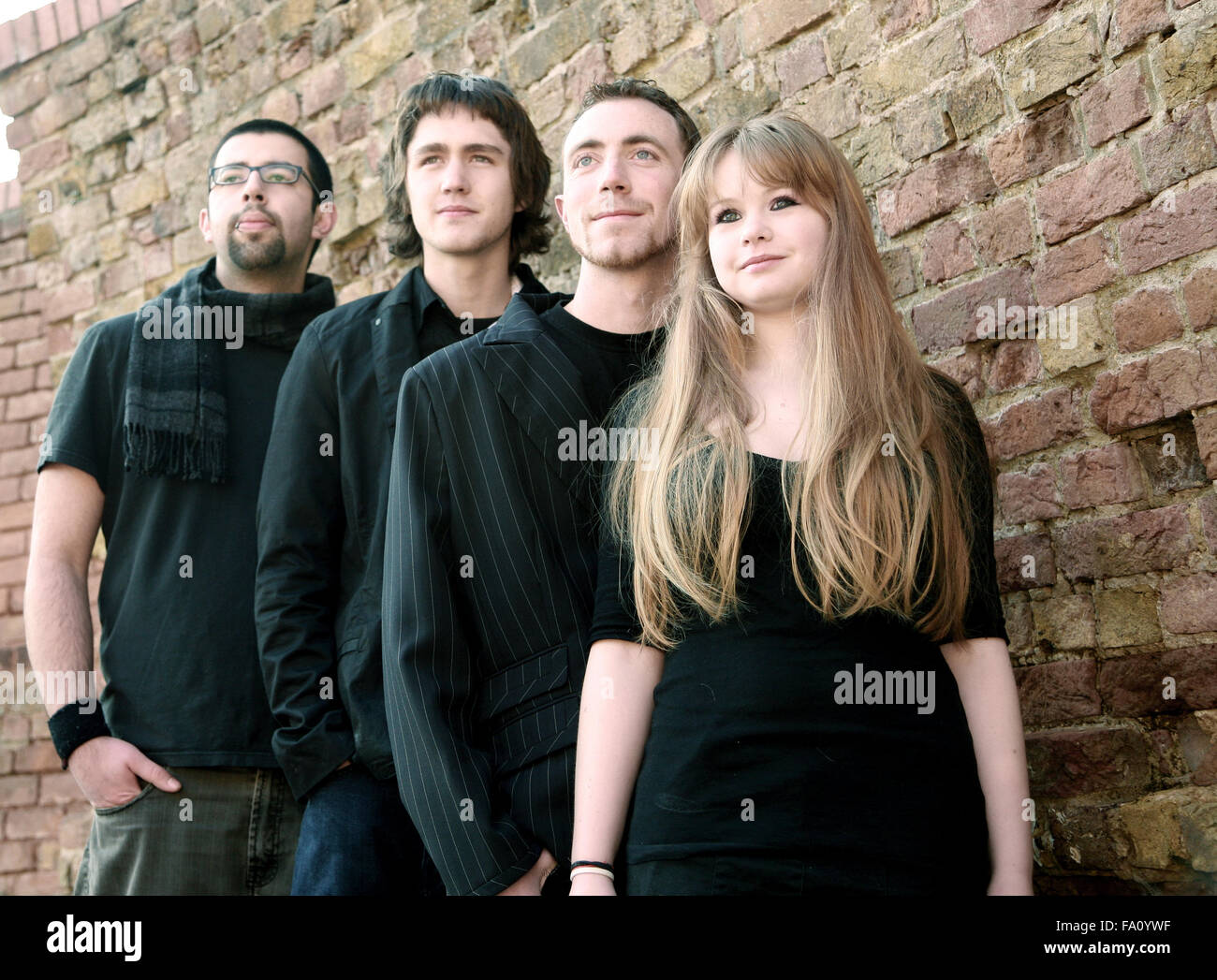 Four young friends who were in a rock metal band together Stock Photo ...