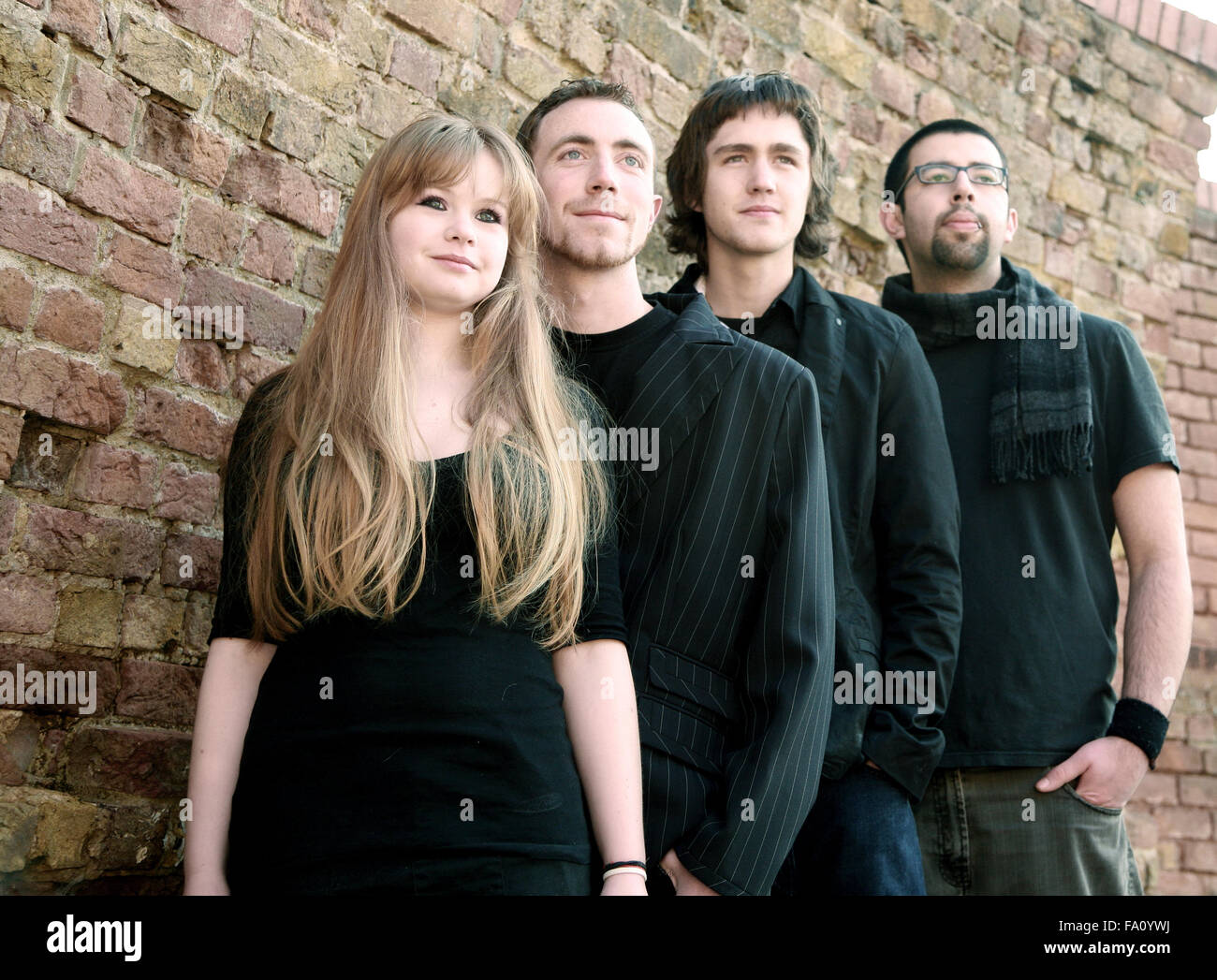Four young friends who were in a rock metal band together Stock Photo ...