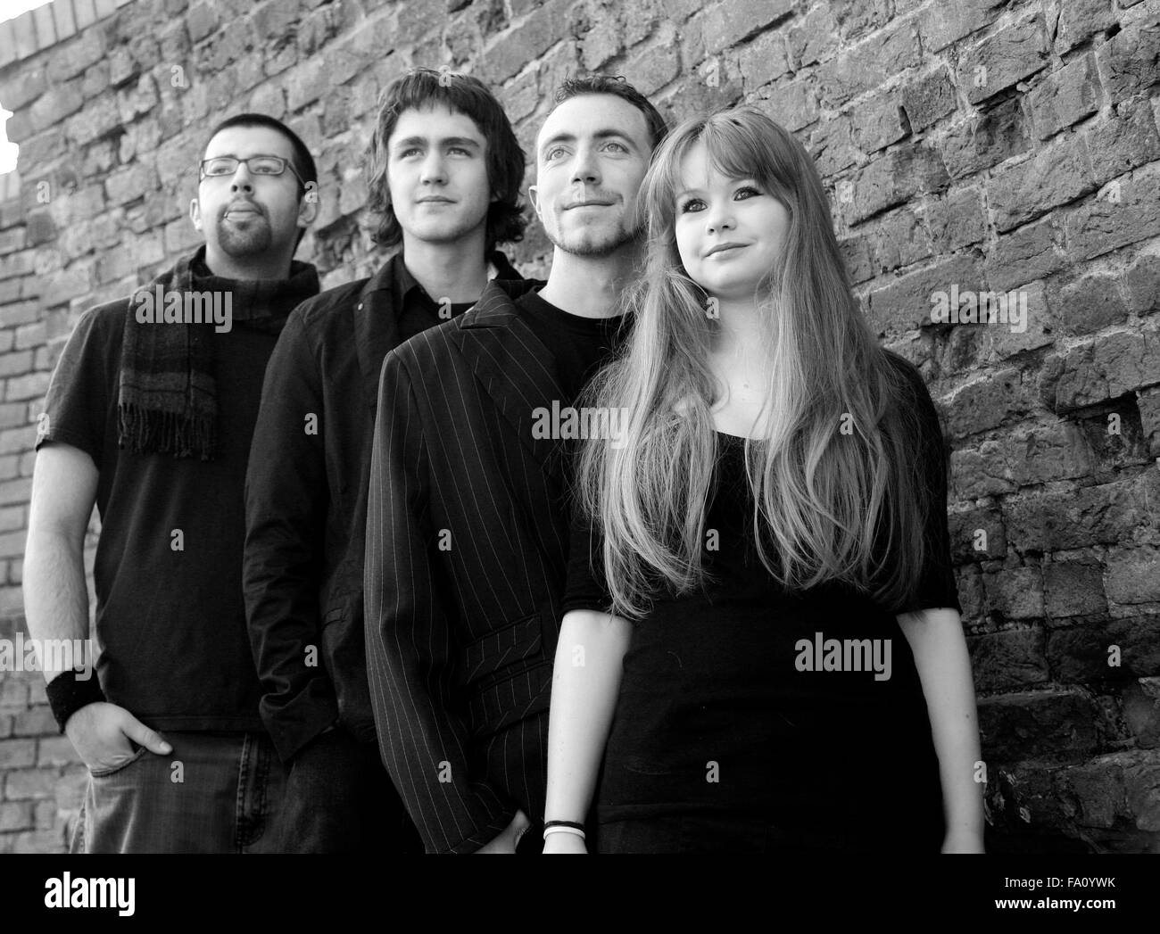 Four young friends who were in a rock metal band together Stock Photo ...