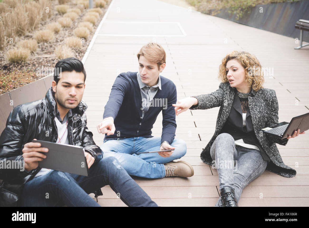 Multiracial contemporary business people working outdoor in town ...