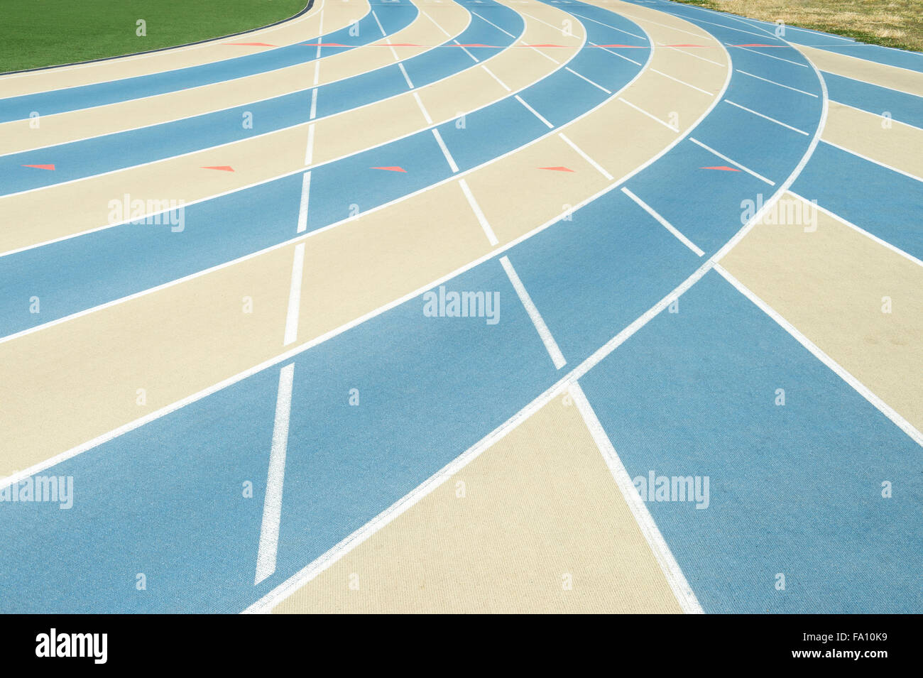 Modern running track background in blue and tan full frame close-up ...