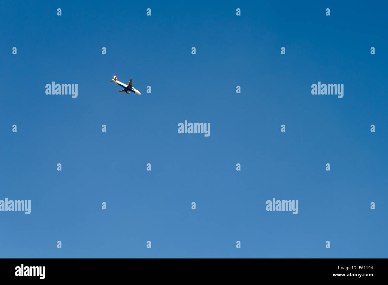 Airplane On Clear Blue Summer Sky Stock Photo - Alamy