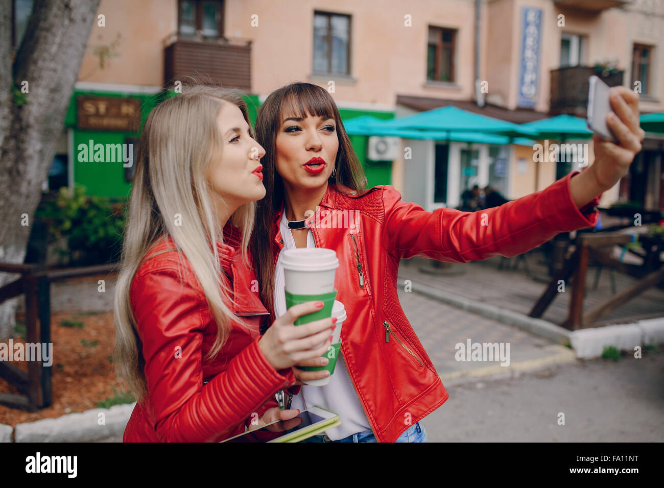 girls with phone Stock Photo - Alamy