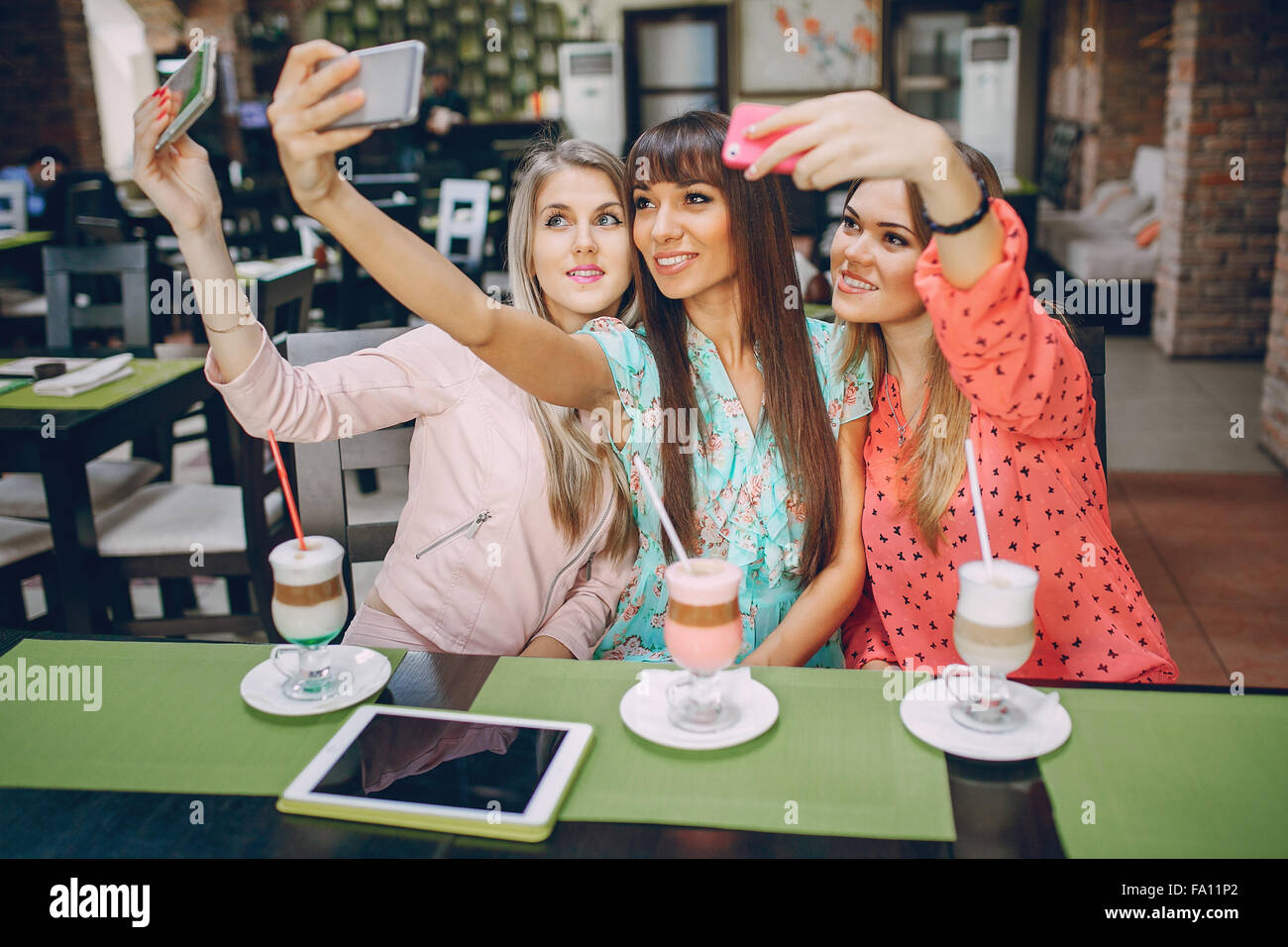 Girls with phones Stock Photo - Alamy