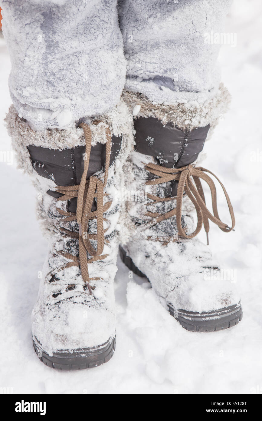 Boots in the snow Stock Photo - Alamy