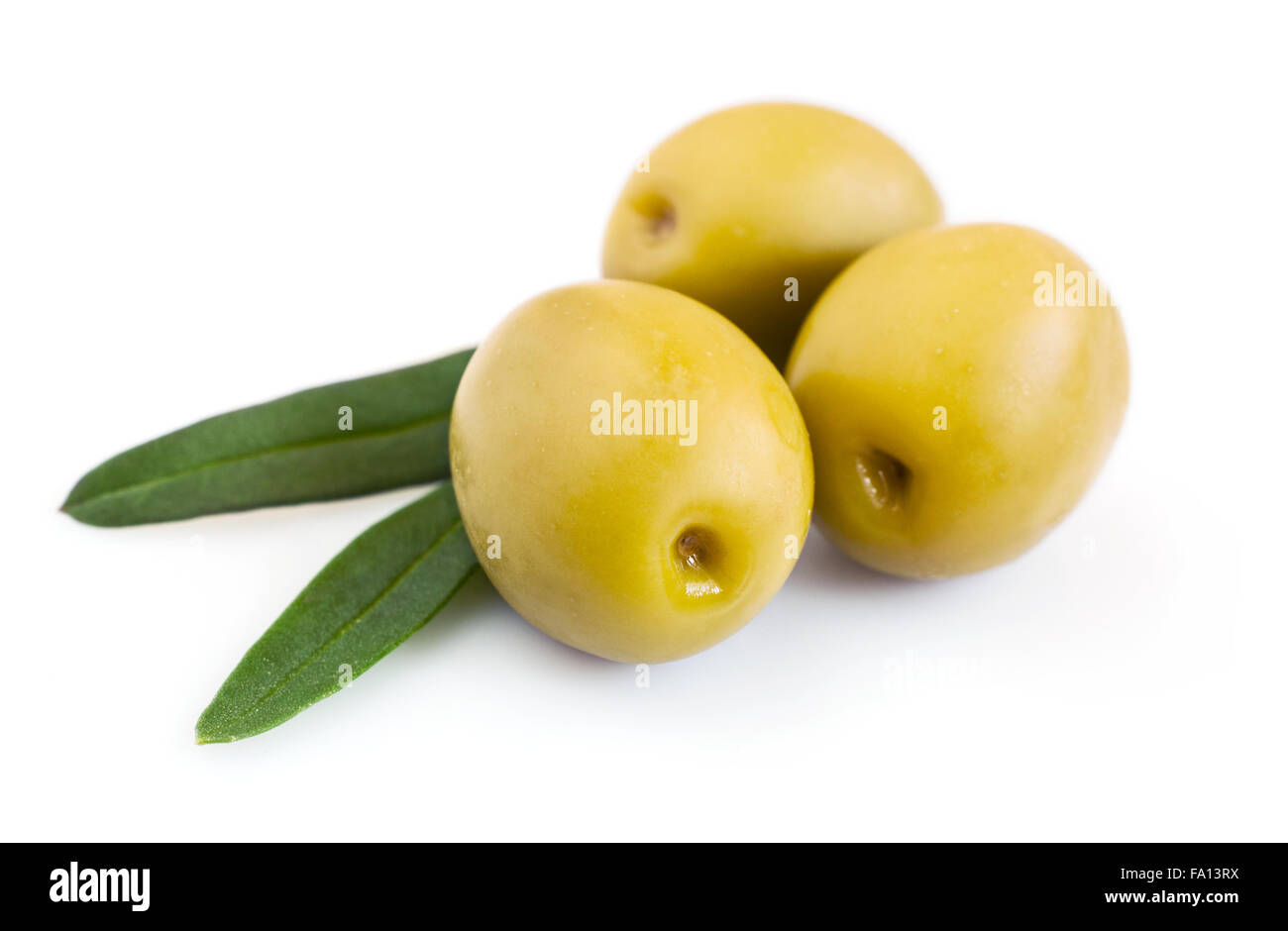 Three green olives isolated over white Stock Photo - Alamy