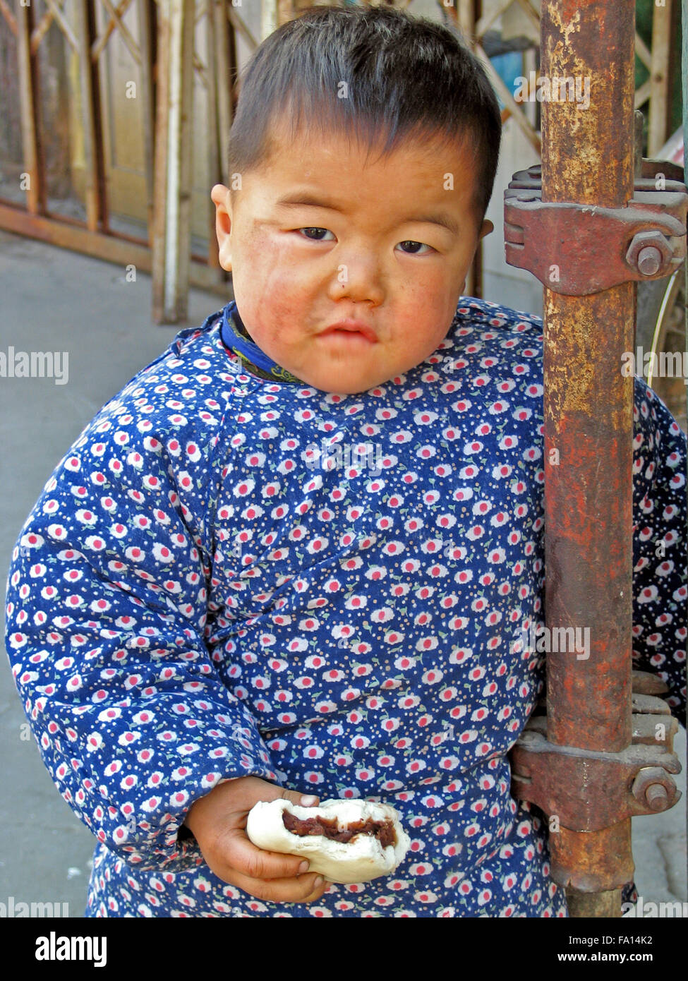Plump Chinese boy with dumpling Stock Photo - Alamy