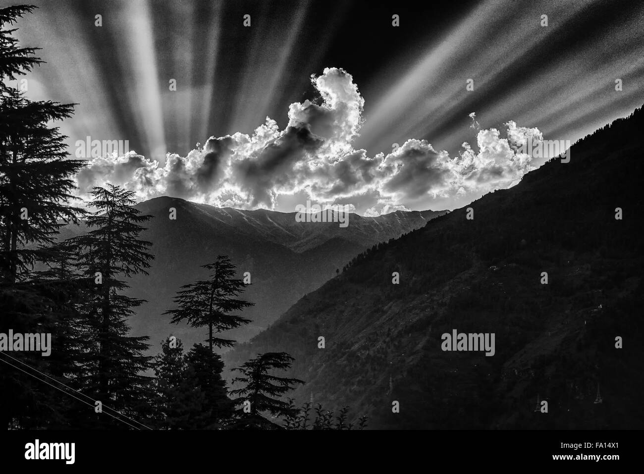 Sun rays over mountains. Black and white image Stock Photo - Alamy
