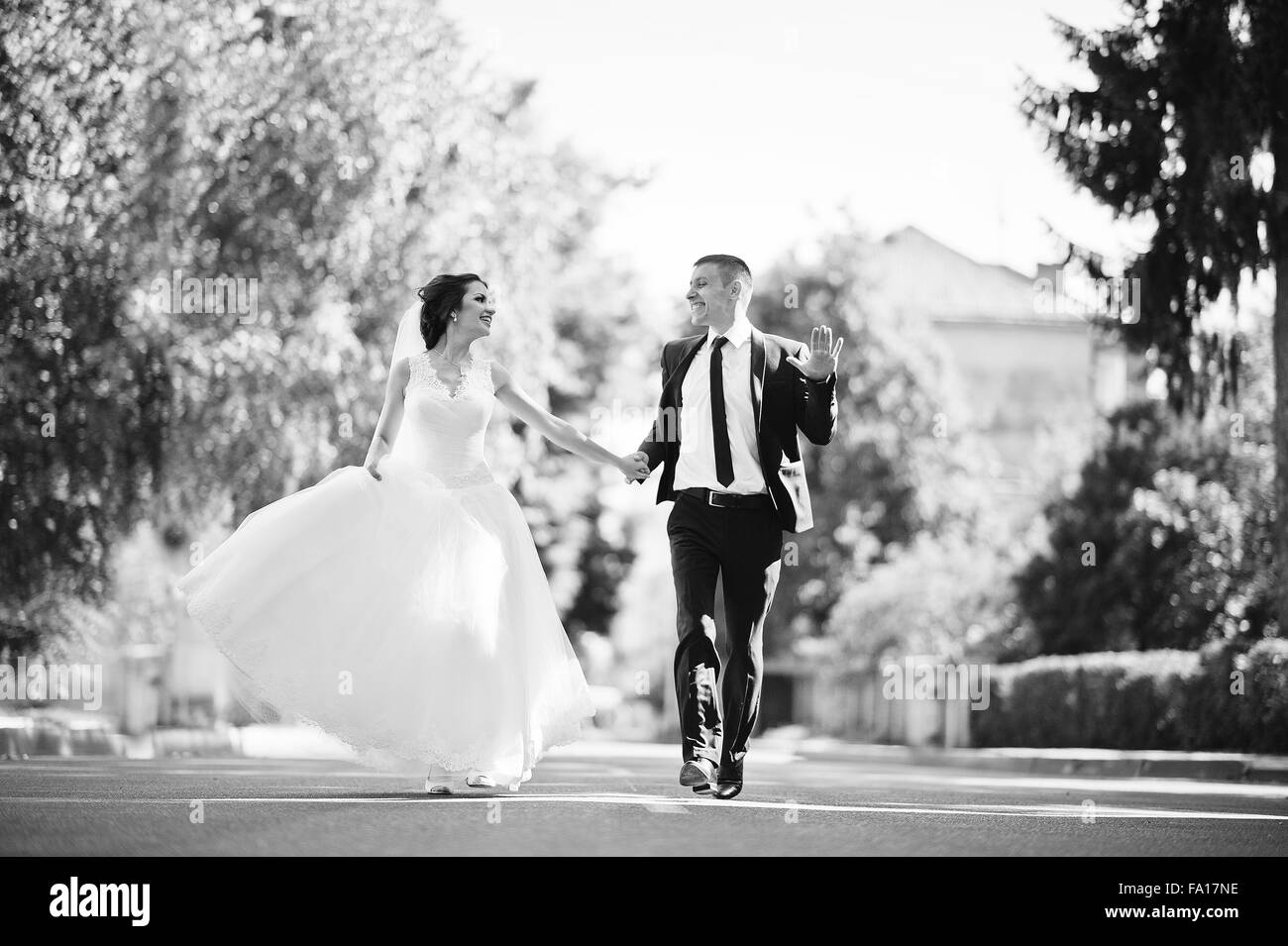 Happy bride groom running laughing hi-res stock photography and images ...